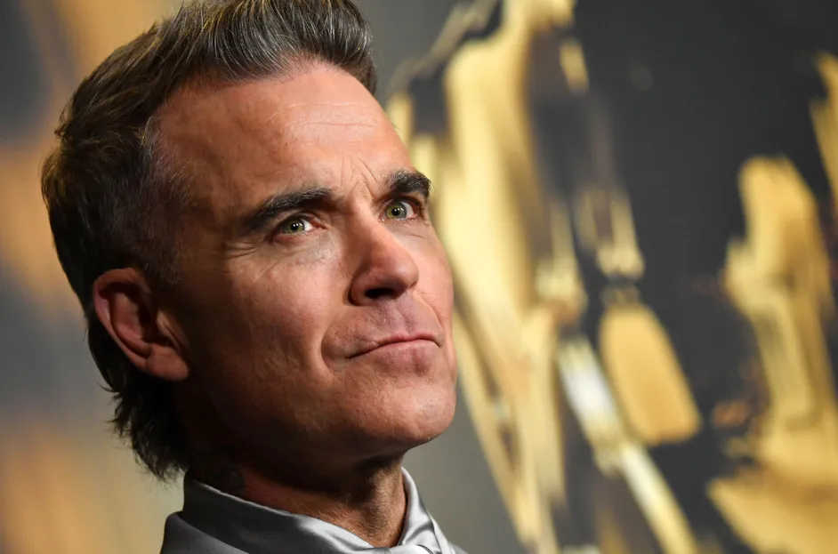 Robbie Williams Reflects on Family Illnesses and Emotional Journey in ...